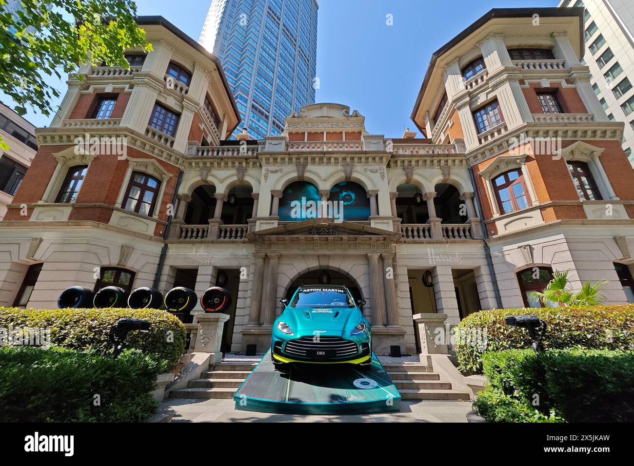 SHANGHAI, CHINA - MAY 10, 2024 - An Aston Martin DBX car leans on the ...
