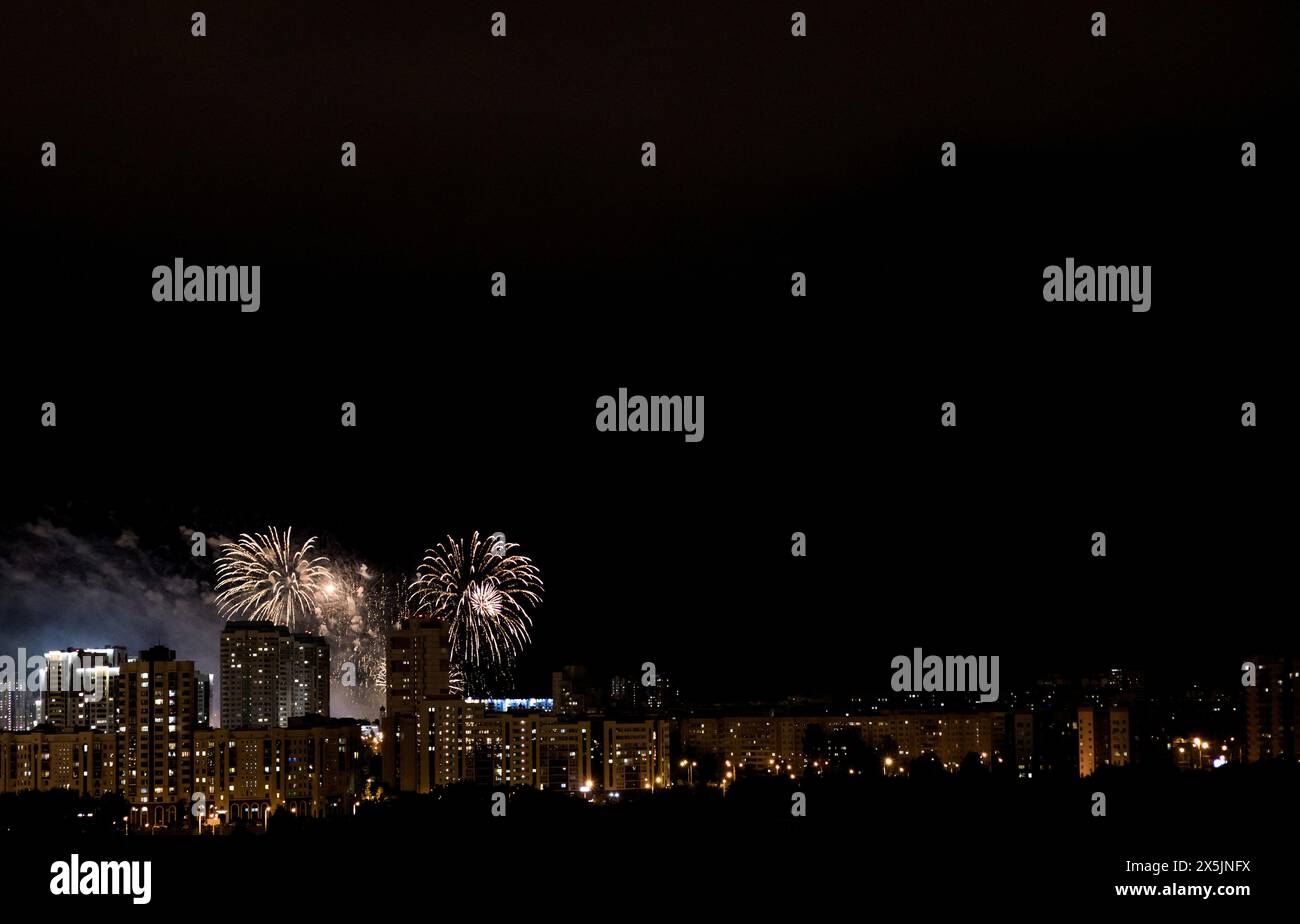 Skyline with fireworks light up sky over building Stock Photo - Alamy