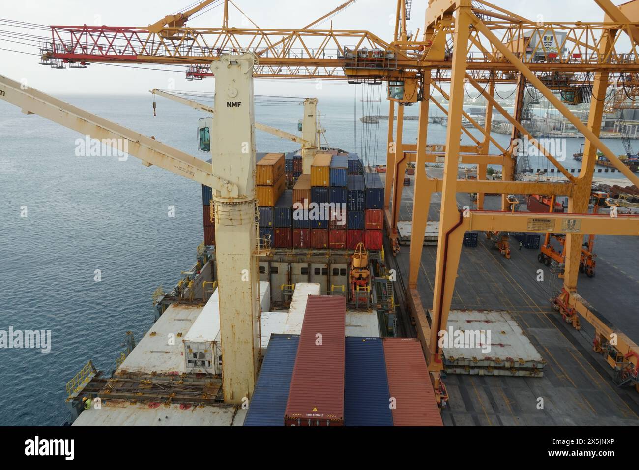 Container vessel equipped with cranes during cargo operation loading ... Container vessel equipped with cranes during cargo operation loading ...