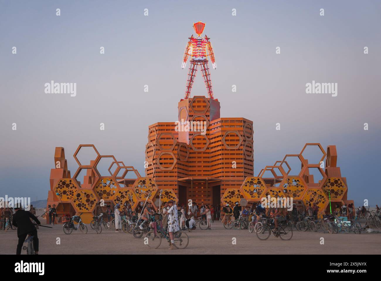 Elaborate humanoid structure in desert festival at twilight Stock Photo ...