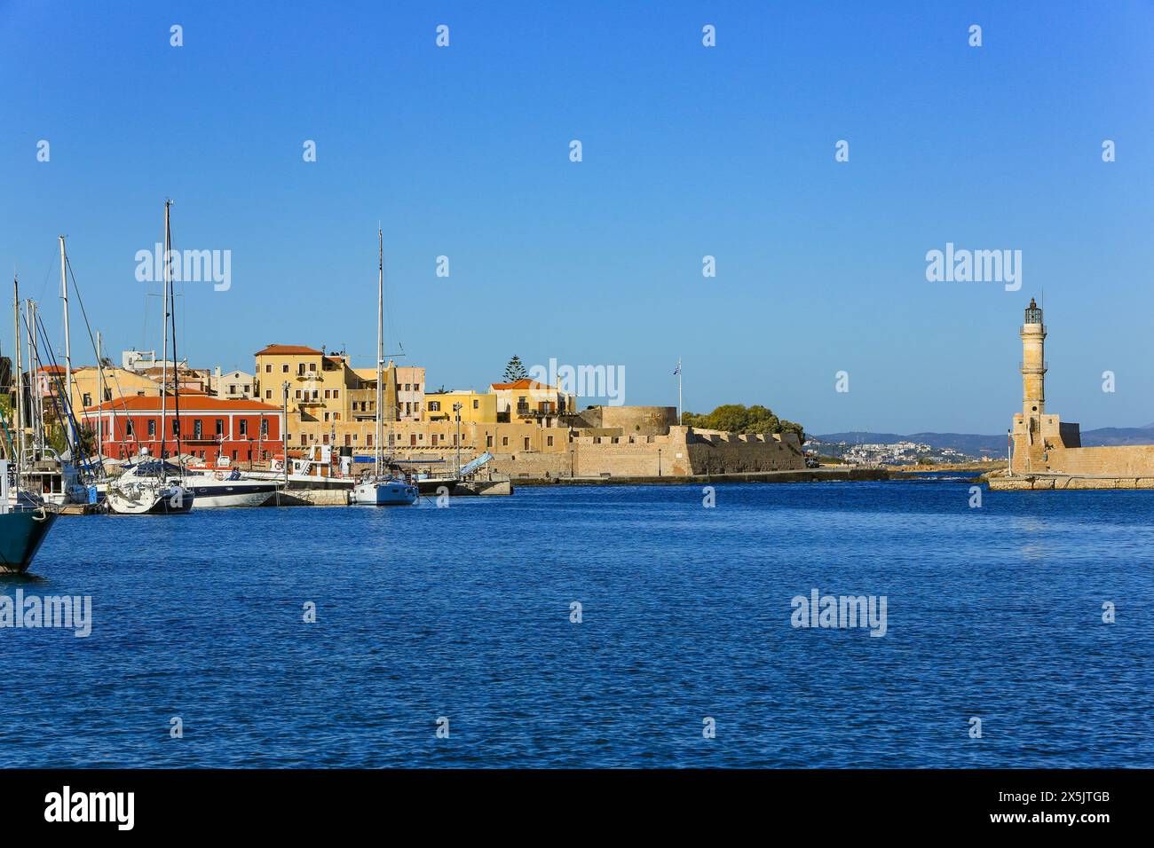 Chania, Crete, Greece. Old town walled city and harbor with lighthouse ...