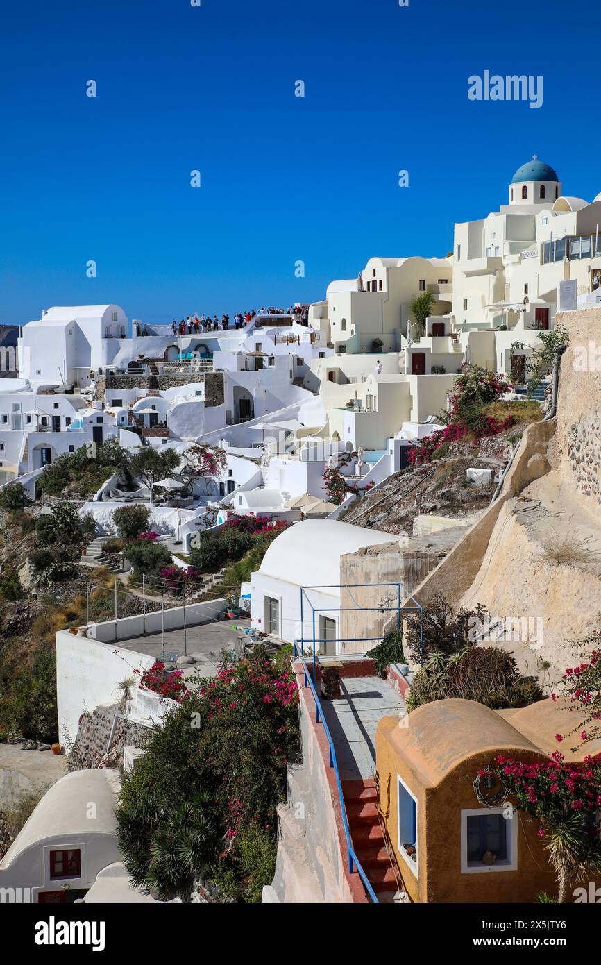 Oia, Santorini, Greece. Blue dome Greek church, tourists, white washed ...