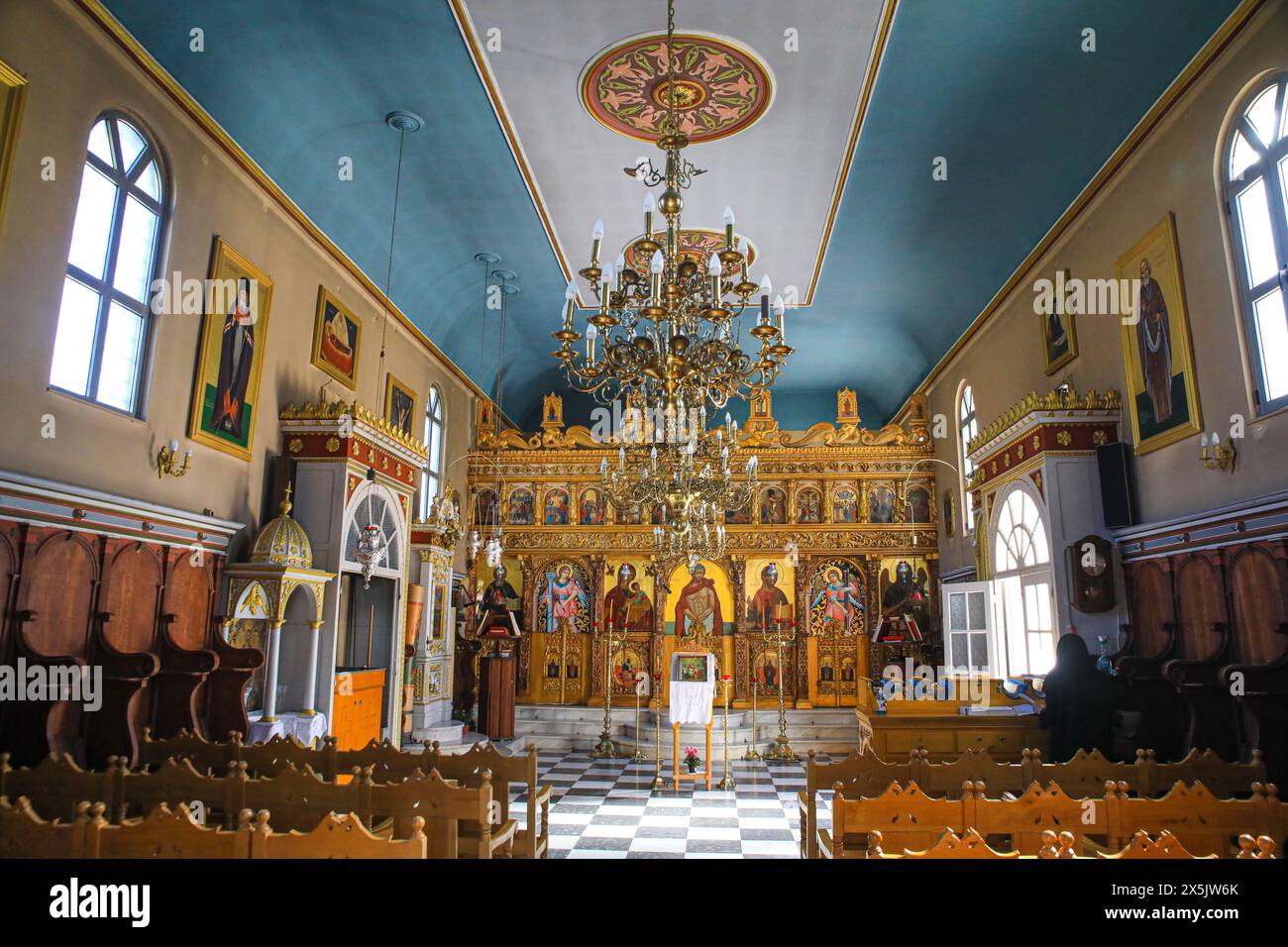 Greece. Greek orthodox church interior with golden wall paintings of ...