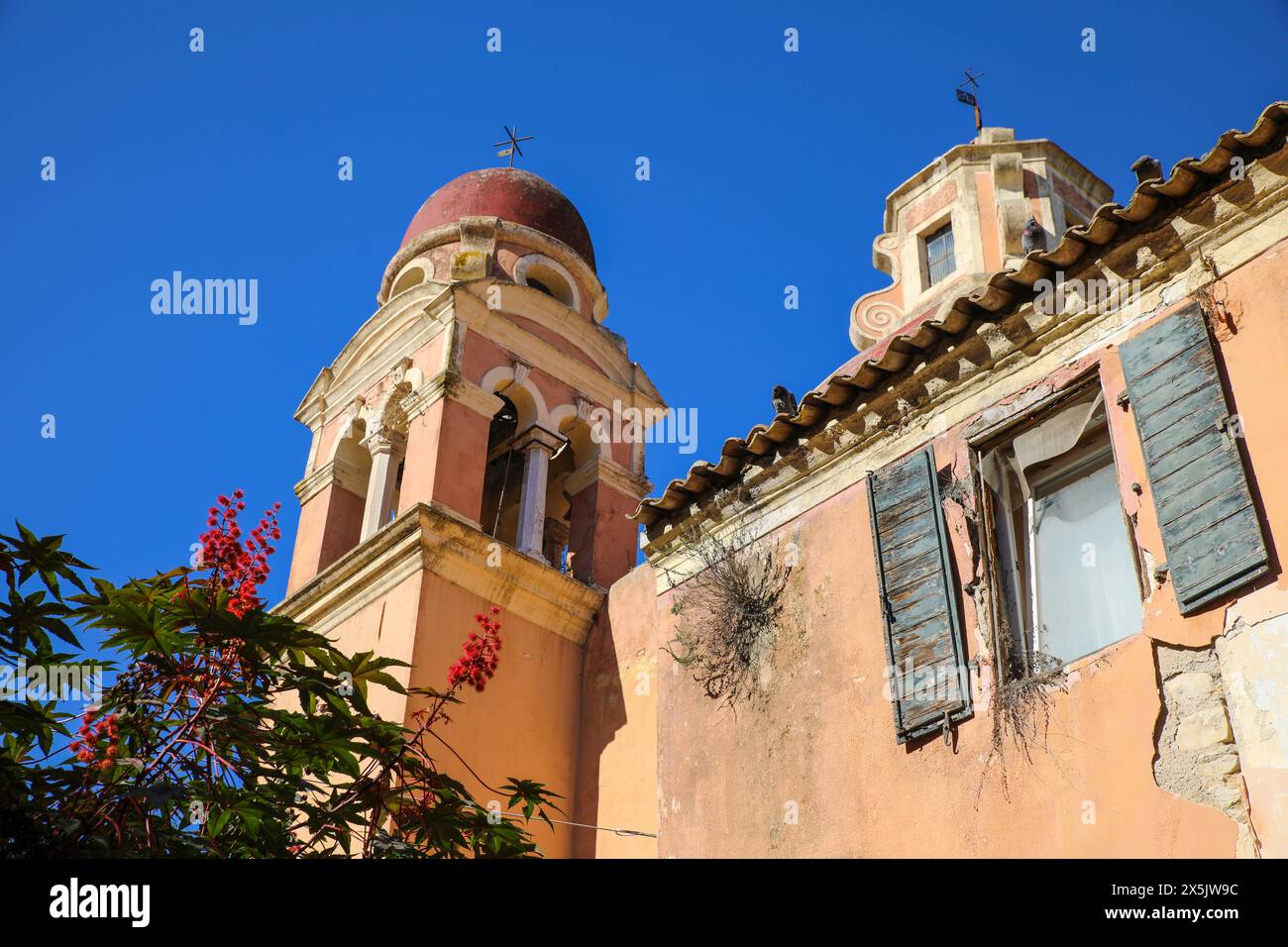 Corfu, Greece. Red domed terra cotta church, shutters and red ...