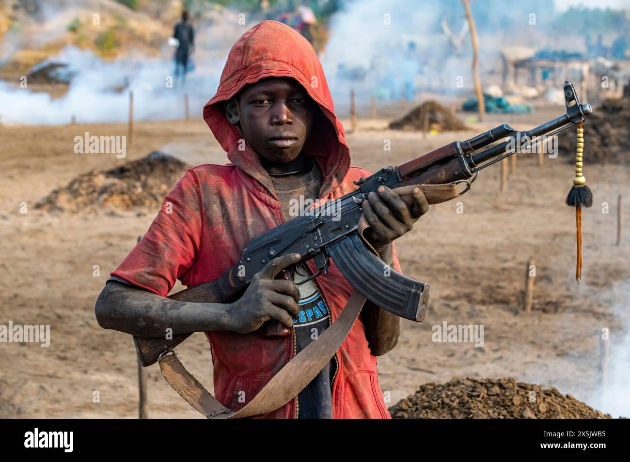 Young boy posing with Kalashnikov, Mundari tribe, South Sudan, Africa ...