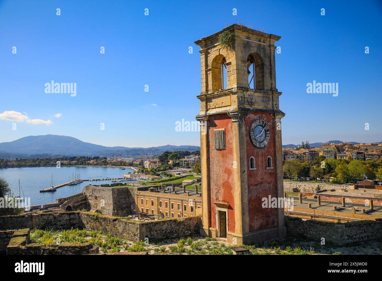 Corfu, Greece. Old clock terra cotta tower and view of Corfu, old town ...