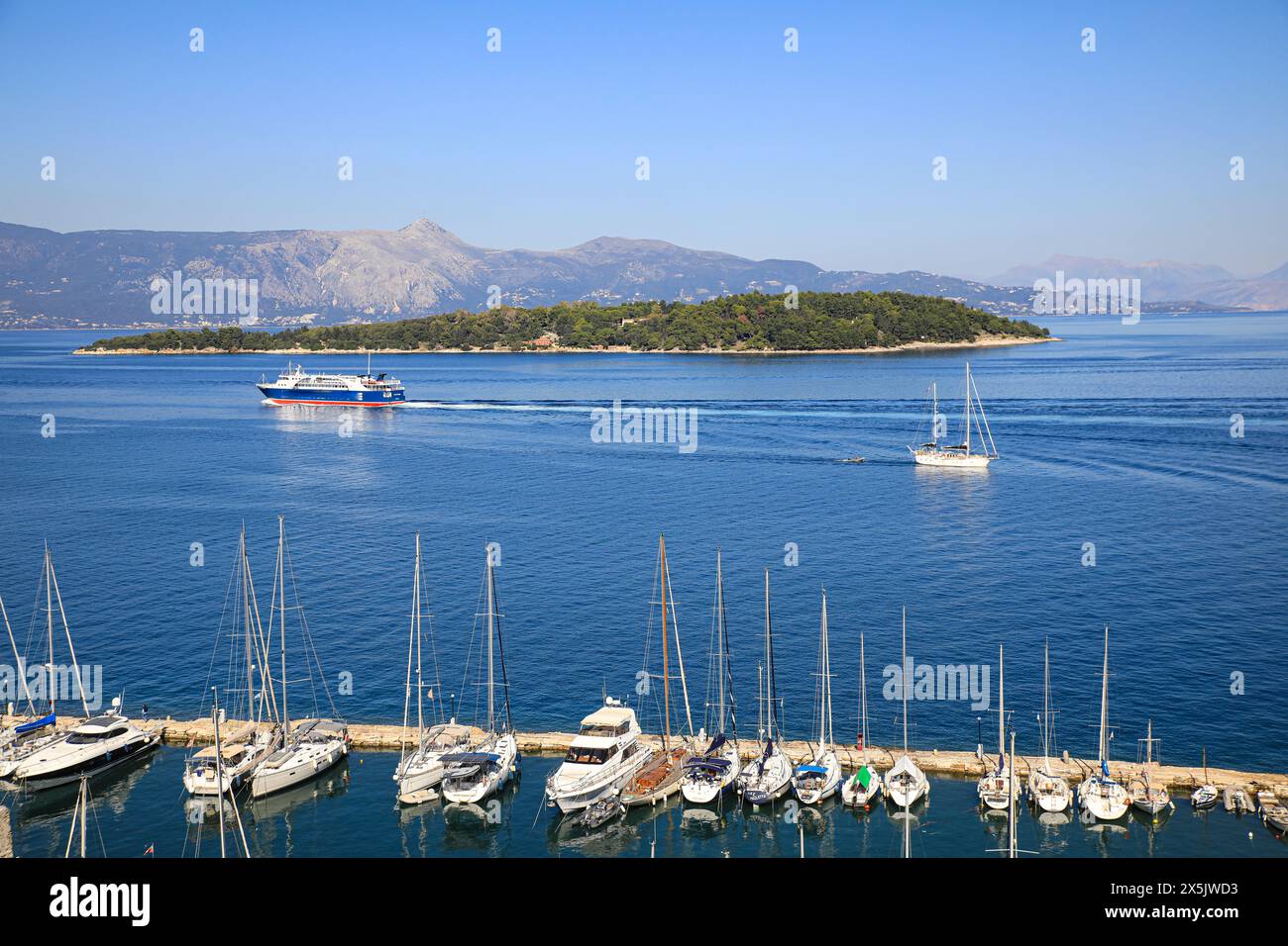 Corfu, Greece. Sailing the sightseeing boat and a sailboat marina Stock ...