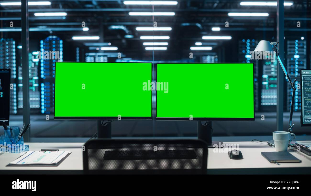 On the Desk Standing Green Mock-up Screen Computer. In the Background ...