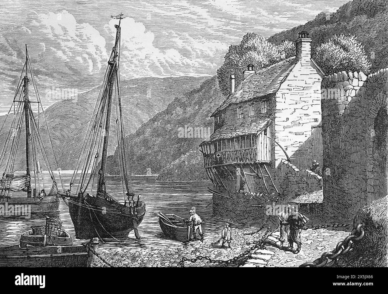 Fishing boats in Clovelly Harbour in the late 19th century. Black and ...