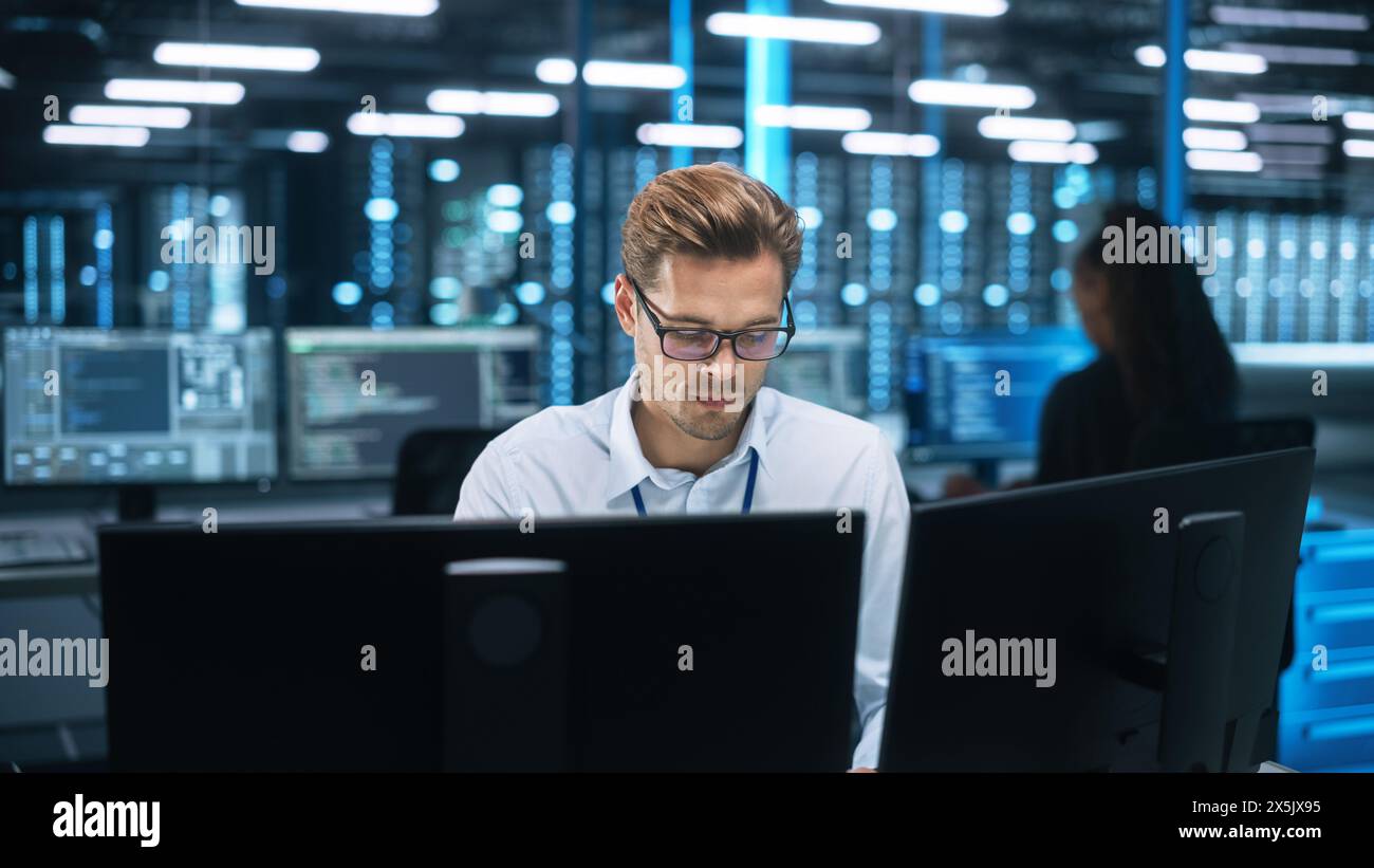 Engineer coding in data center hi-res stock photography and images - Alamy