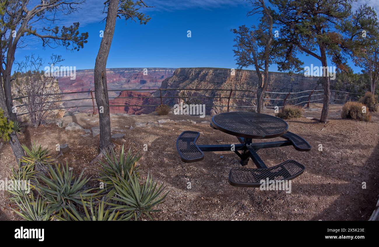 Steel picnic table along the rim trail overlooking Grand Canyon South ...