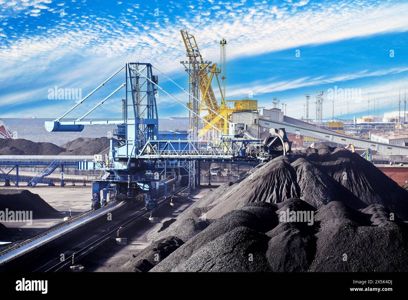 Coal harbor at maritime dry bulk cargo terminal, bucket wheel stacker ...