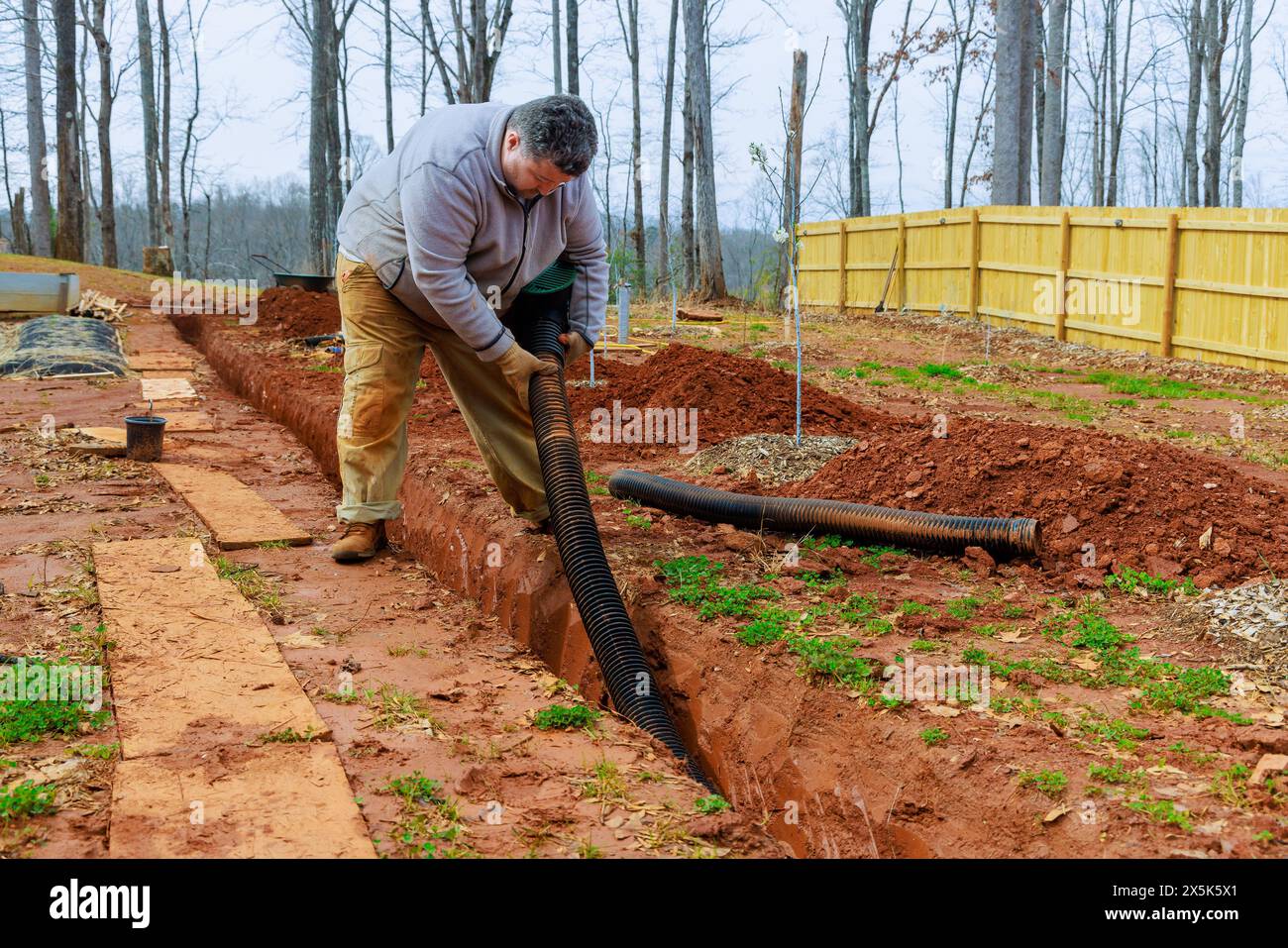 Drainage pipe for storm drainage installed into trench drains Stock ...
