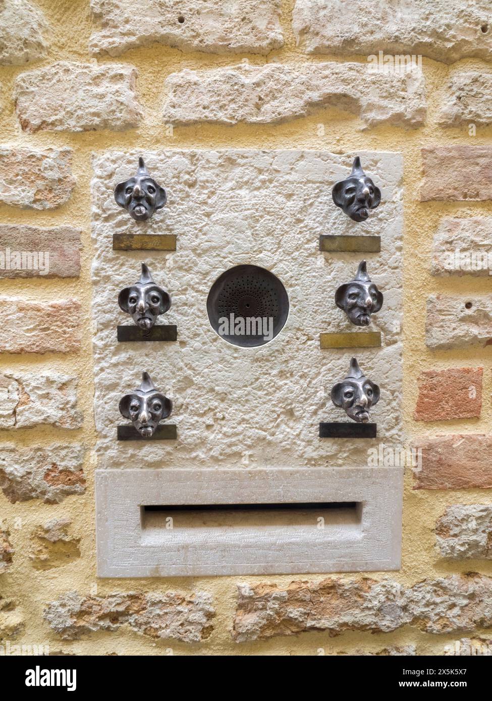 Italy, Venice. Combination letter slot doorbell nameplate and intercom ...