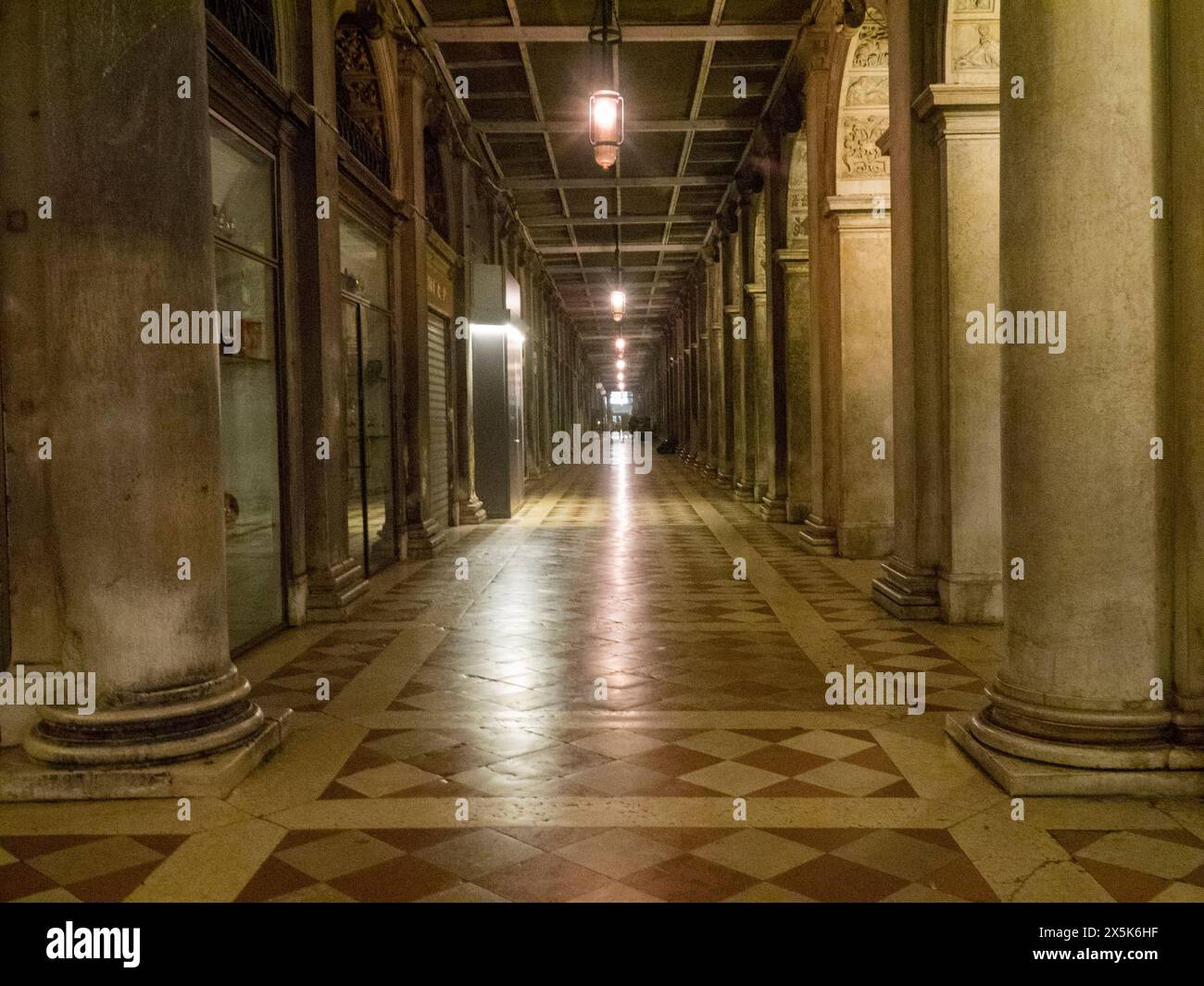 Italy, Venice. Corridor along the Doges Palace with ivory pillars and ...
