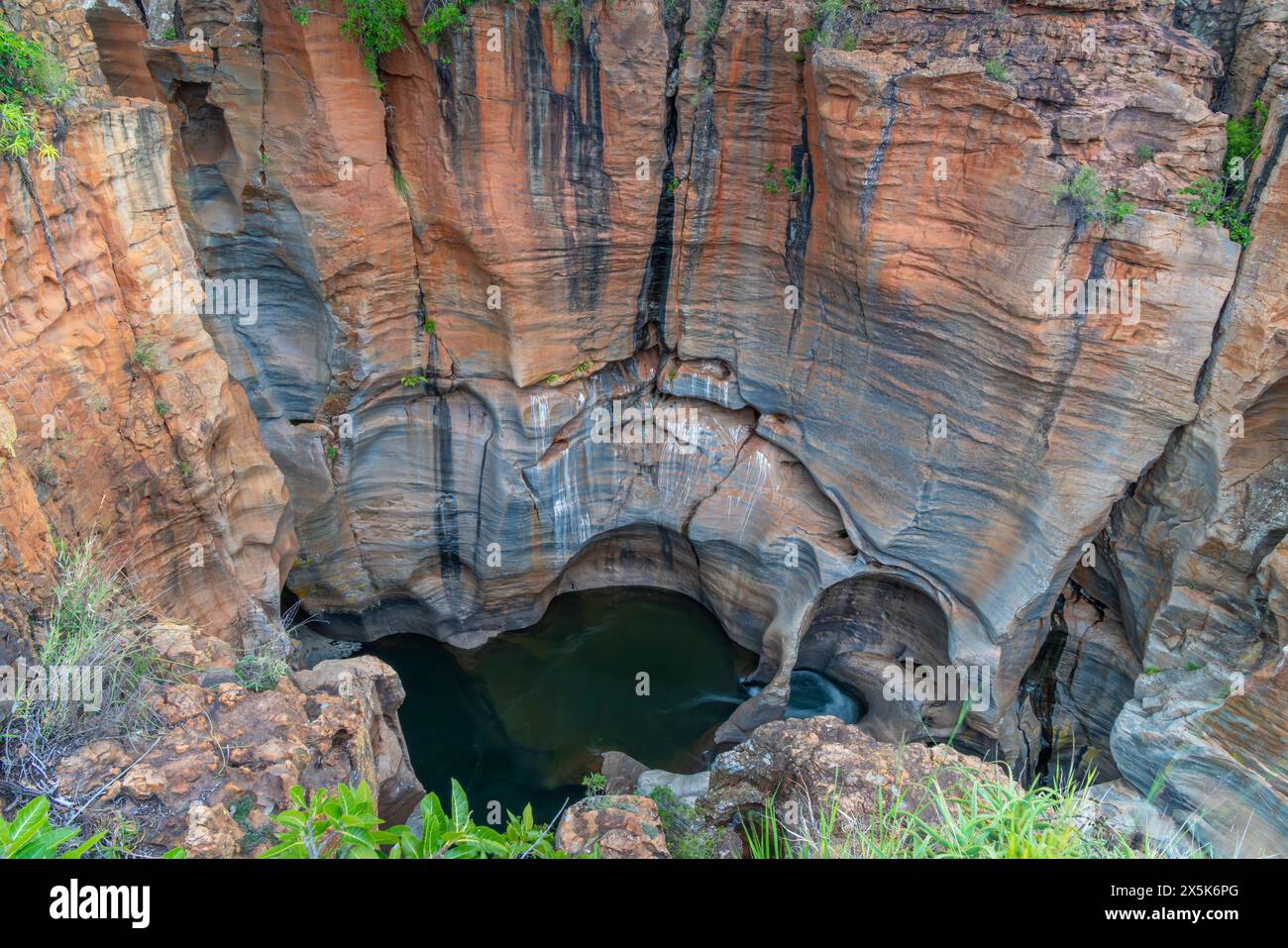 View of complex of smooth, cylindrical potholes and natural rock ...
