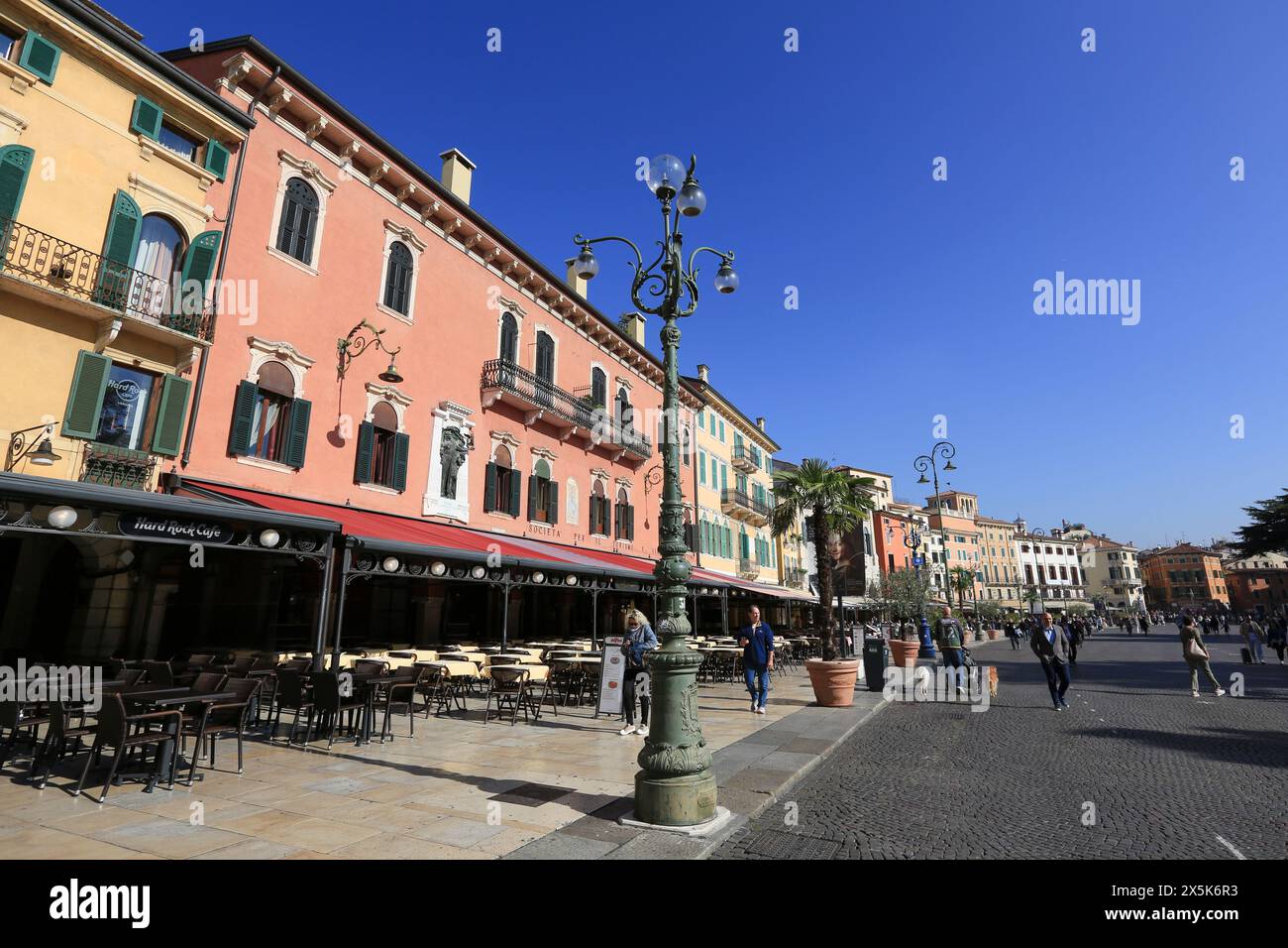 Verona, Italy. Cobblestone pedestrian street with colorful cafe ...