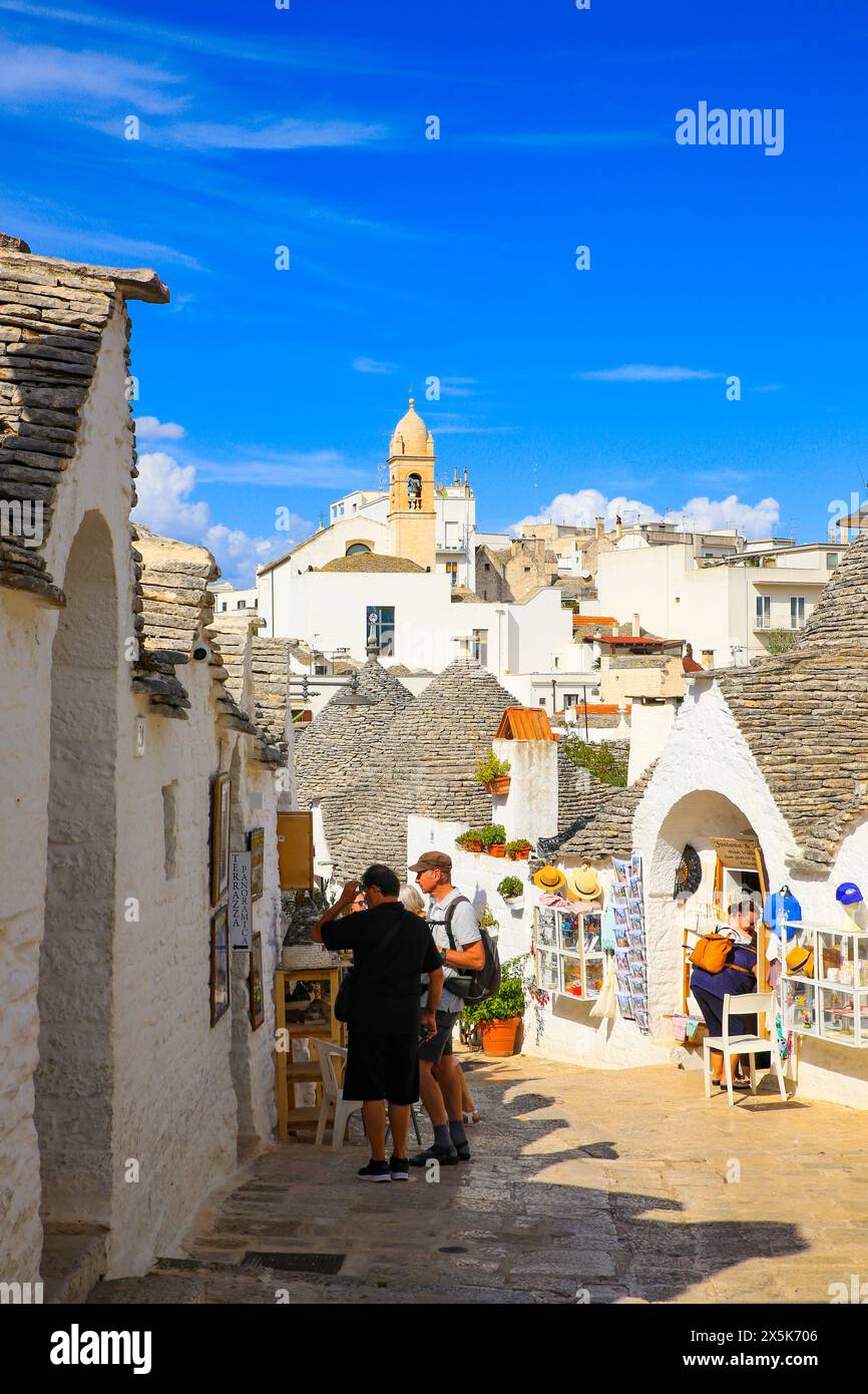 Alberobello, Italy, Puglia. Tourists, people shopping in the white ...