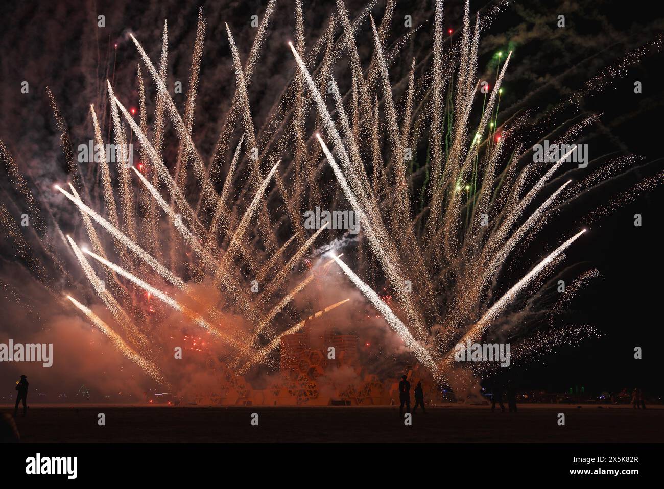 Vibrant fireworks display lighting up desert night sky Stock Photo - Alamy