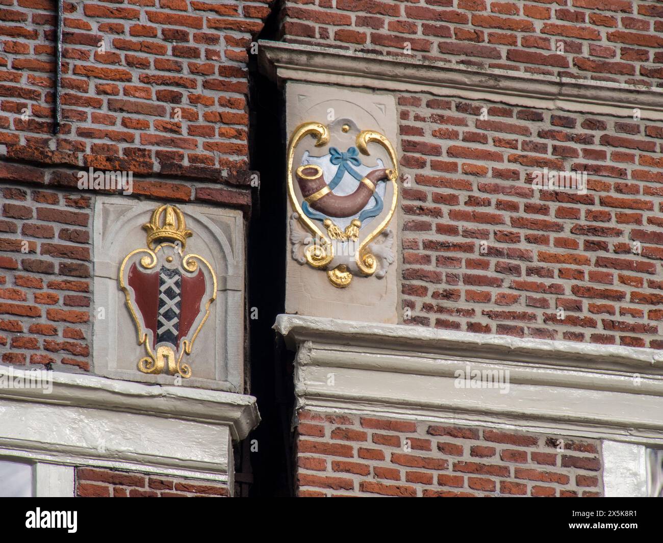 Symbols of the Dutch town of Hoorn on buildings Stock Photo - Alamy