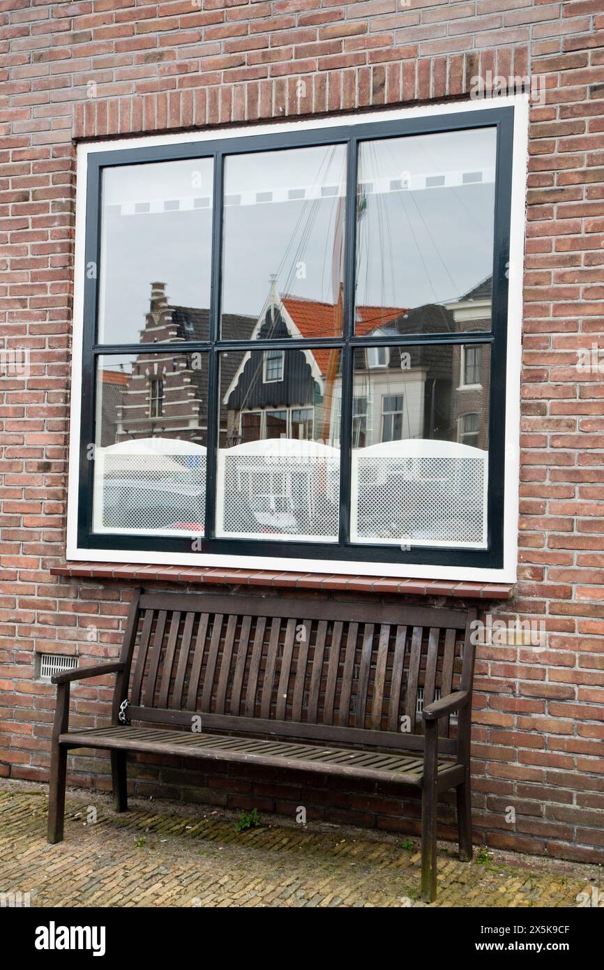 Reflection in a window of typical Dutch architecture in the fishing ...