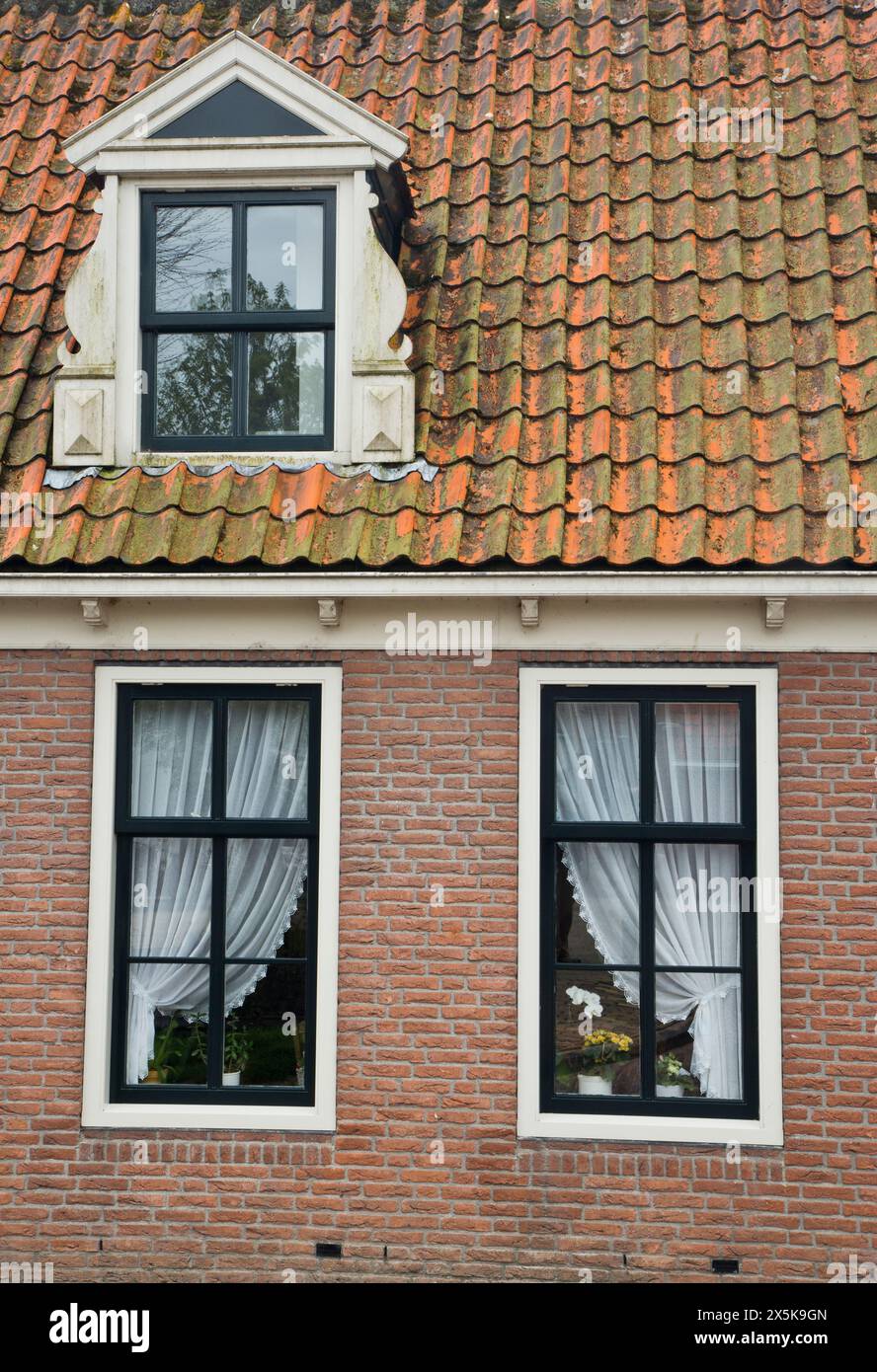 Reflection in a window of typical Dutch architecture in the fishing ...