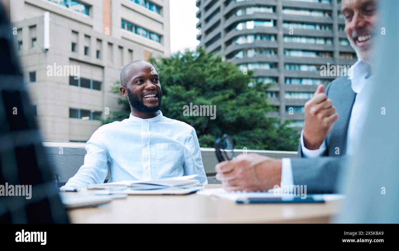 Happy, black man and entrepreneur in meeting outdoor, balcony and ...