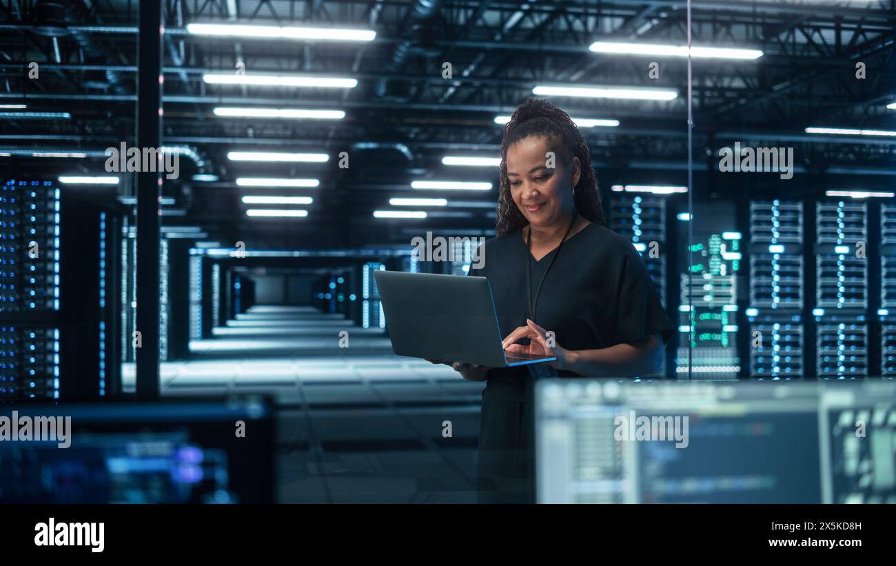 Portrait of Successful African American Female IT Specialist Using ...