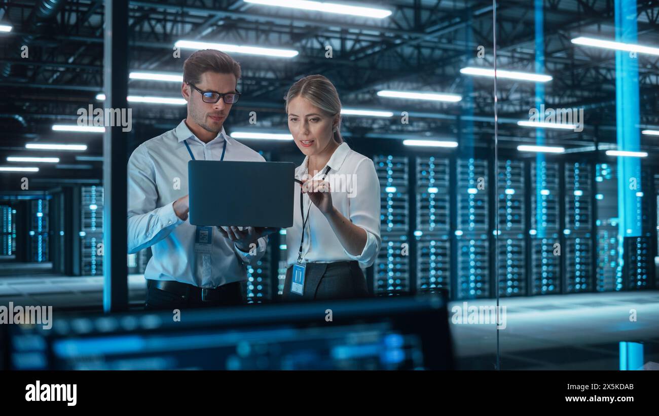 In Technology Research Facility: Female Project Manager Talks With Chief Engineer, they Consults ...