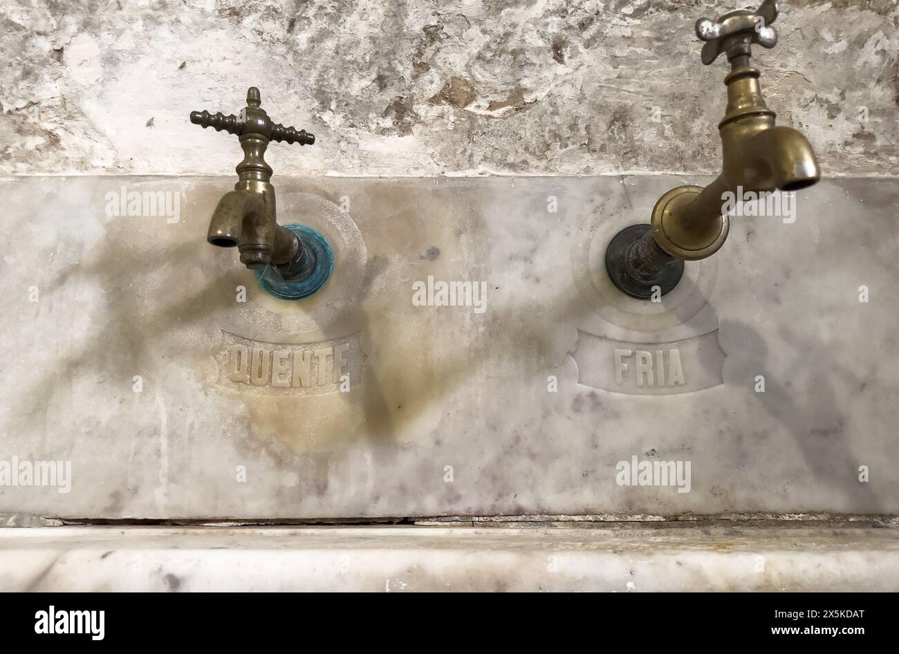 Vintage hot and cold water taps on marble surface Stock Photo - Alamy