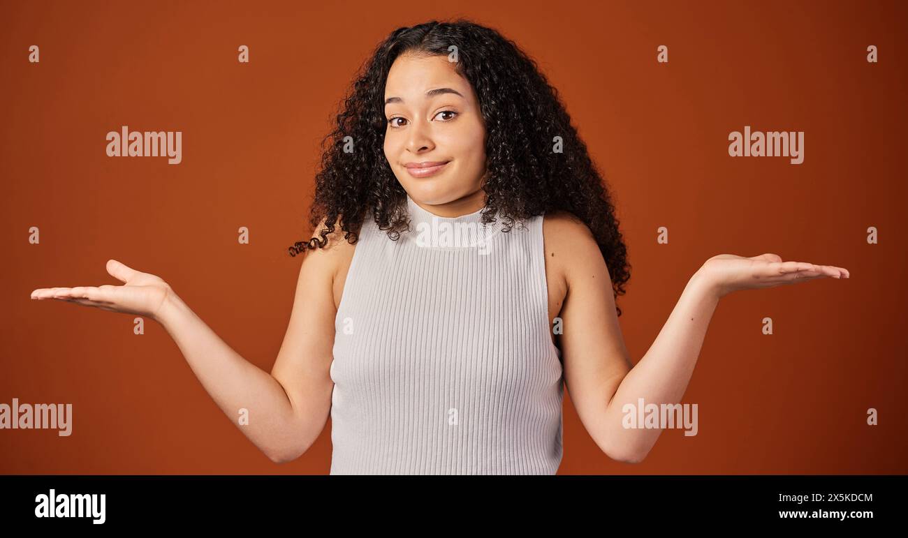 Portrait, woman and studio with comparison, choice and hand gesture on ...