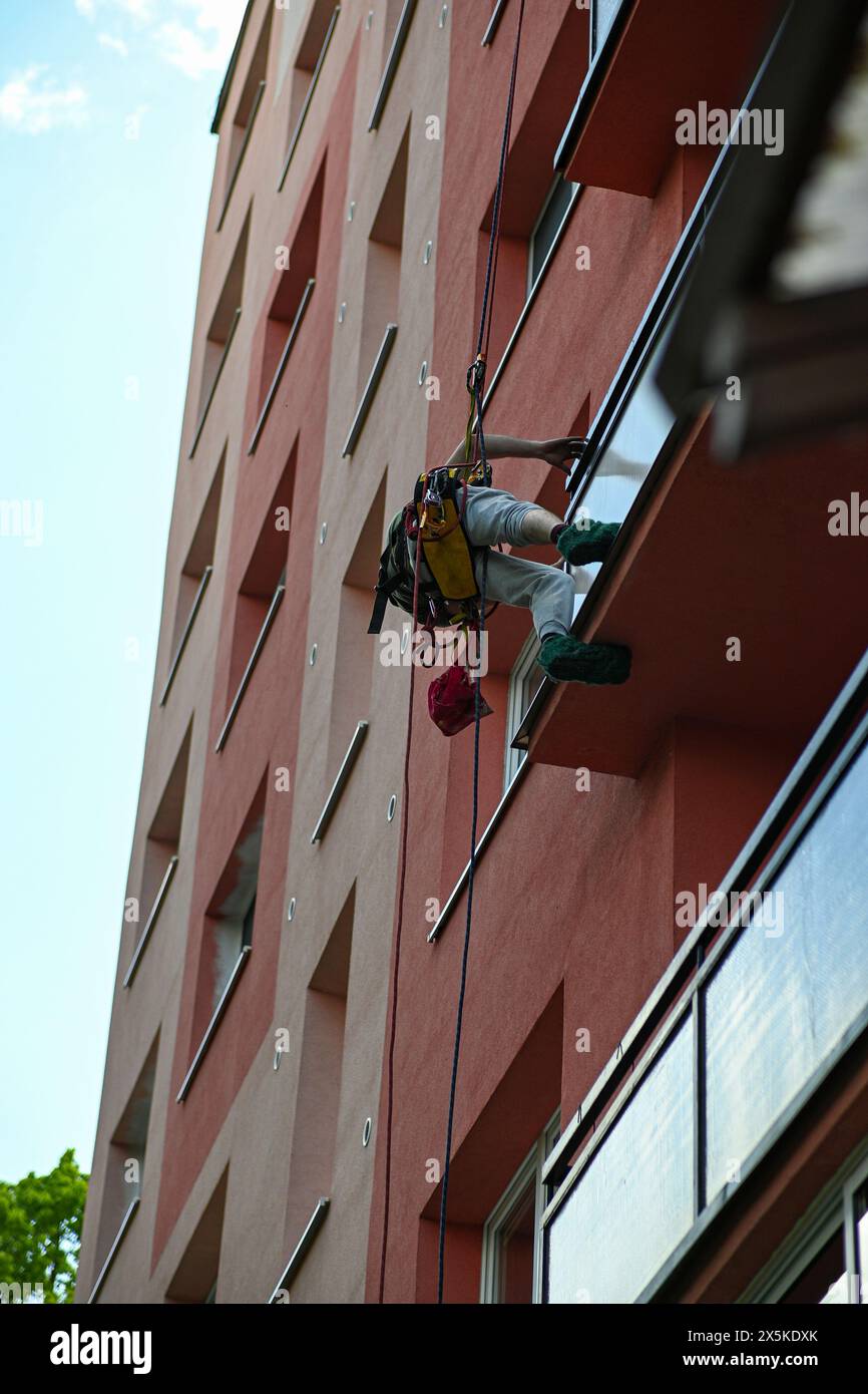 high-rise work on an apartment building. A construction worker inspects ...