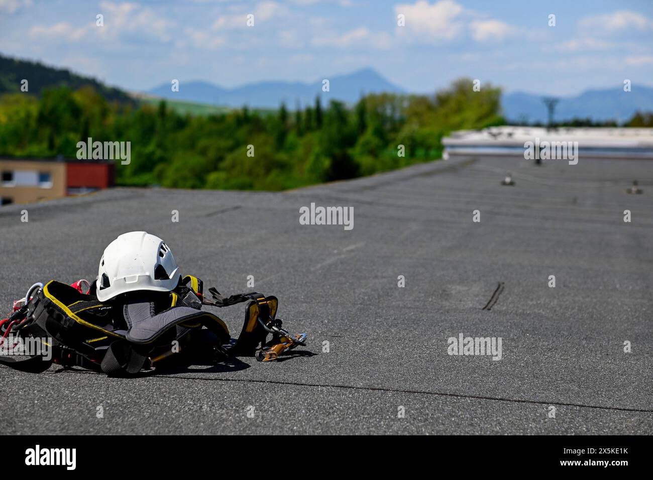 climbing equipment on the roof of an 8-story apartment building ...