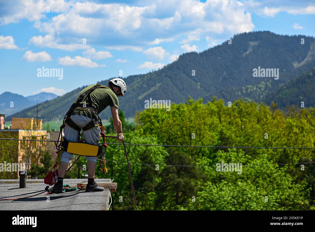 high-rise work on an apartment building. A construction worker inspects ...