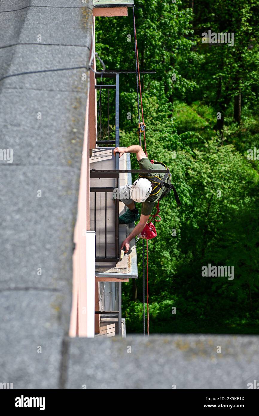 high-rise work on an apartment building. A construction worker inspects ...