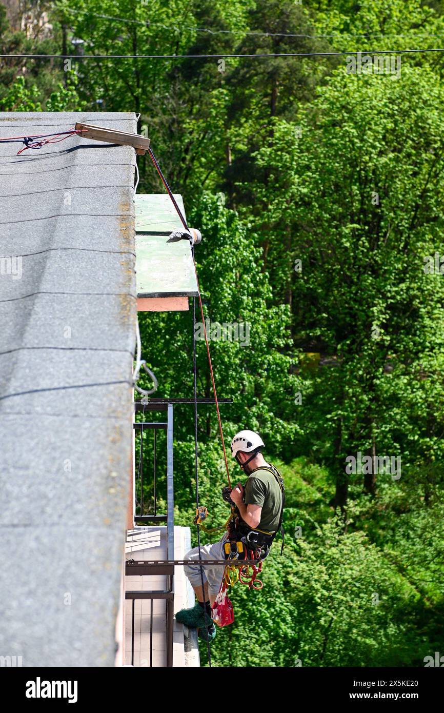 high-rise work on an apartment building. A construction worker inspects ...