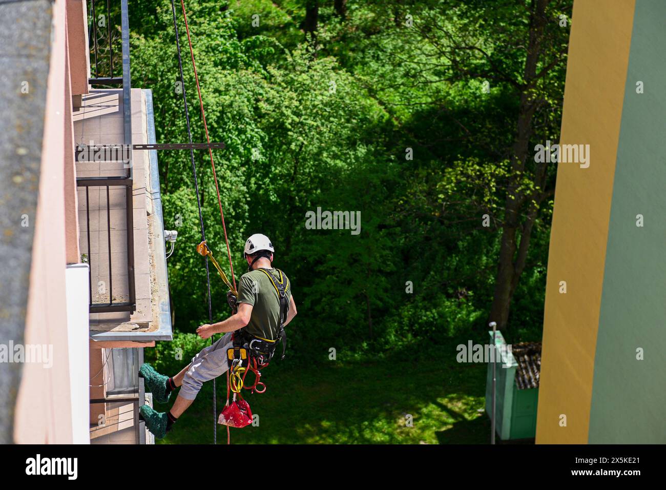 high-rise work on an apartment building. A construction worker inspects ...