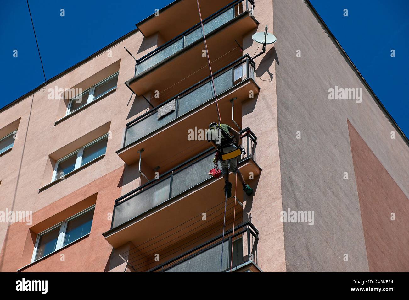 high-rise work on an apartment building. A construction worker inspects ...