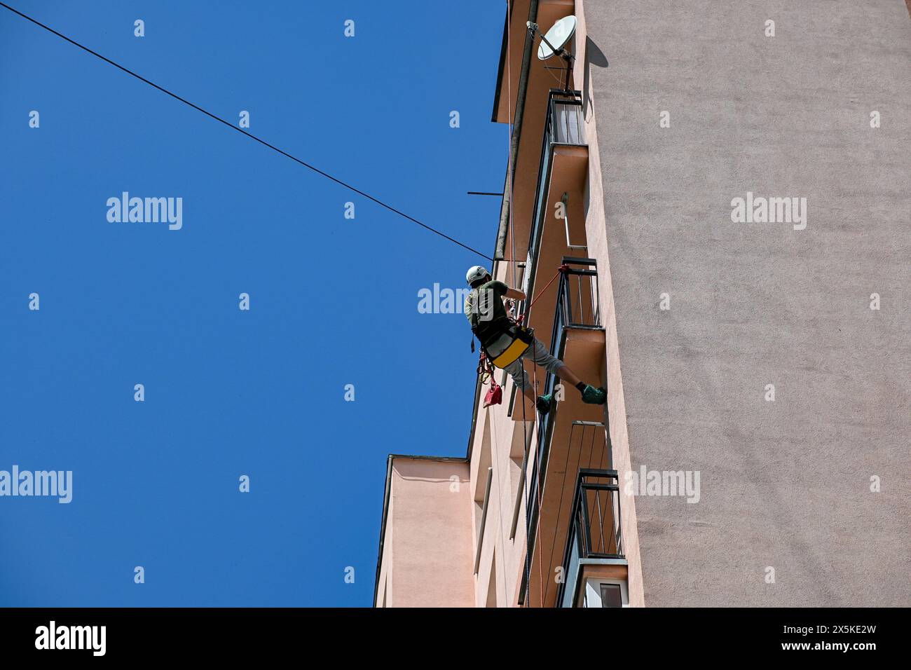 high-rise work on an apartment building. A construction worker inspects ...