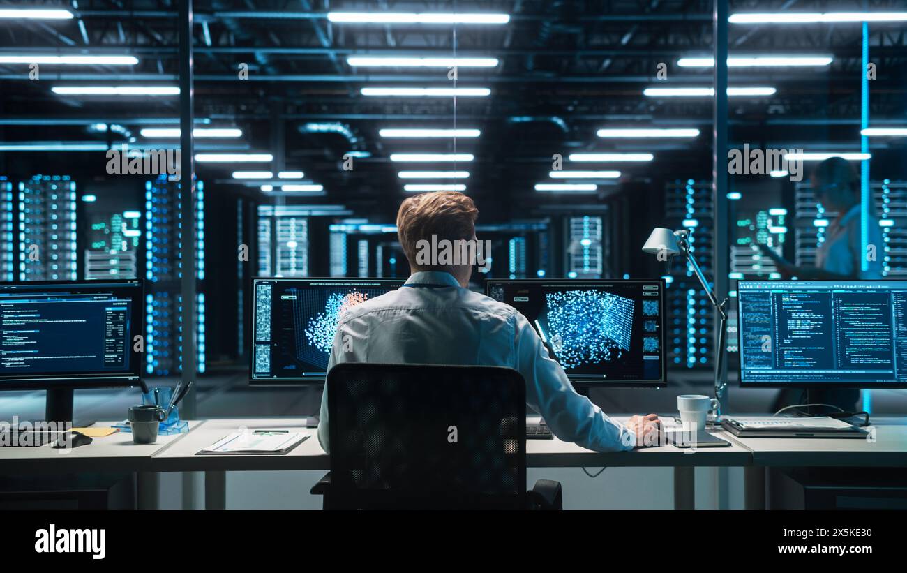 High Tech Data Center Server Control It Specialist Administrator Working On Computer Screen