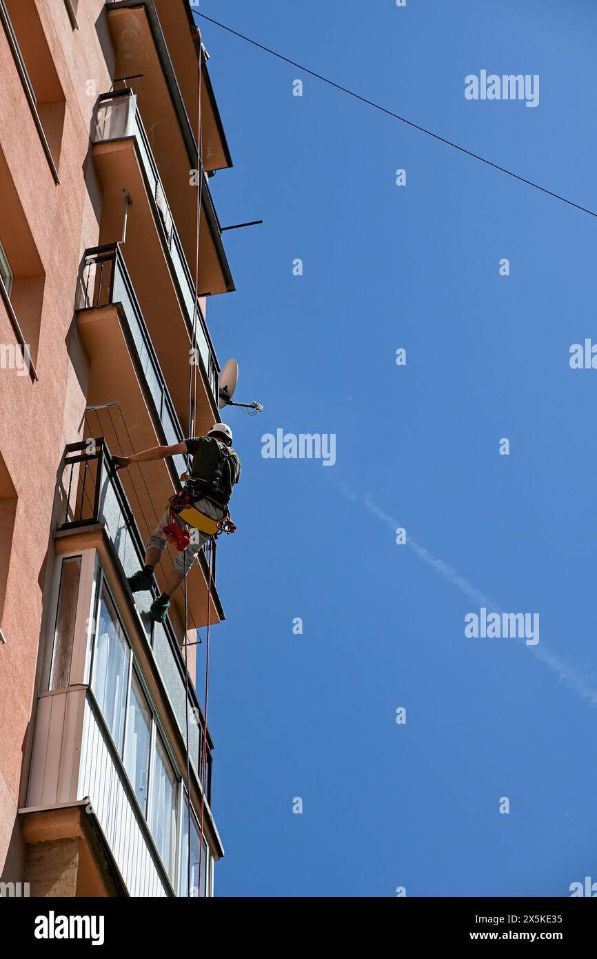 high-rise work on an apartment building. A construction worker inspects ...