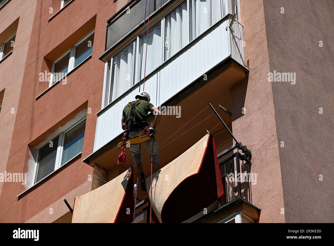 high-rise work on an apartment building. A construction worker inspects ...