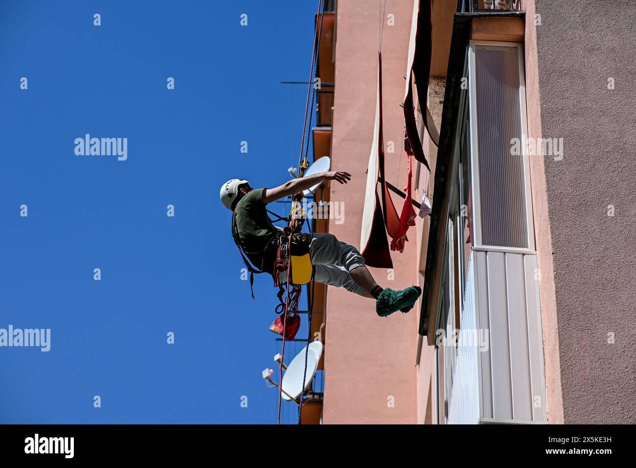 high-rise work on an apartment building. A construction worker inspects ...