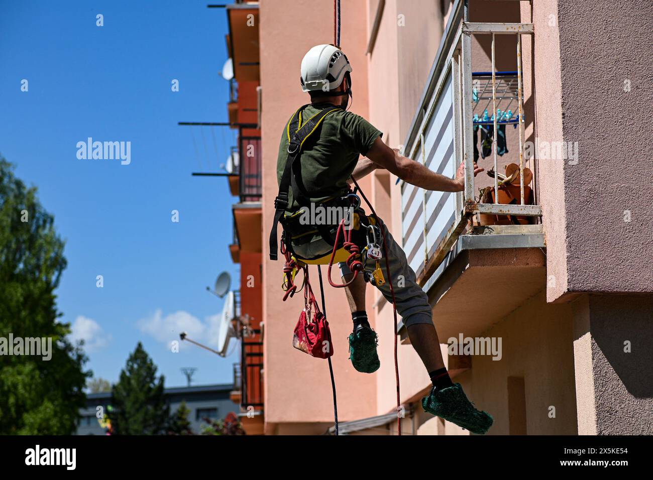 high-rise work on an apartment building. A construction worker inspects ...
