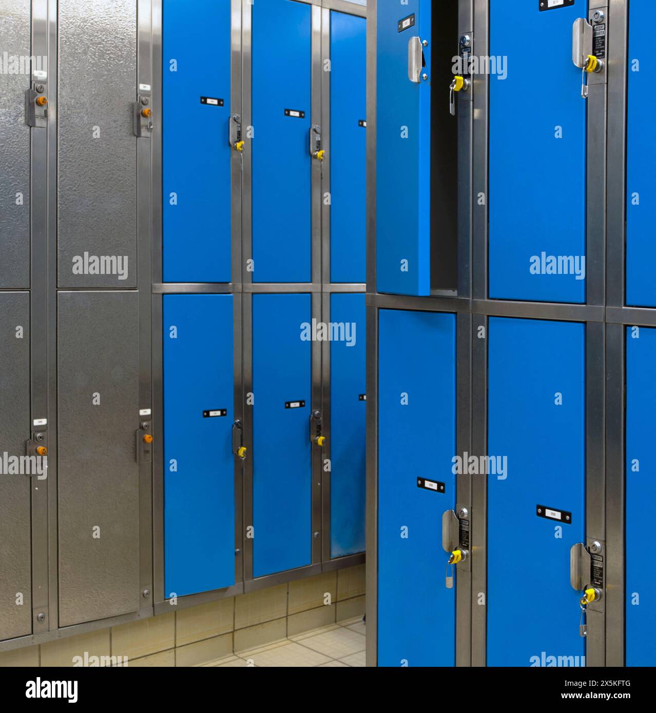 Lockers with blue doors for rent in a public locker room at a ...