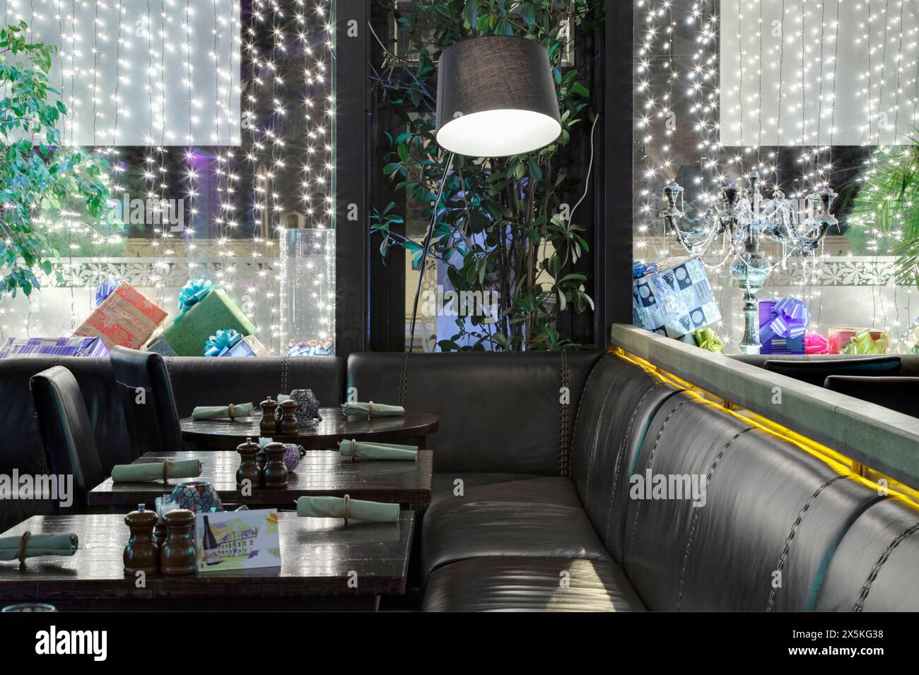 Restaurant windows decorated with gift boxes and illumination Stock ...