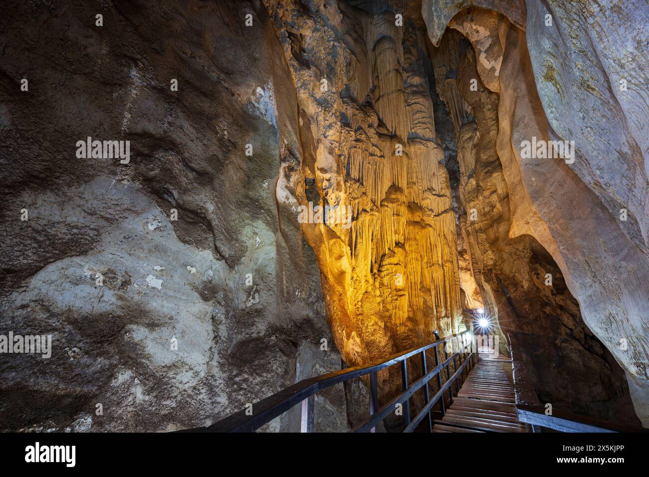 Walkway inside the scenic, illuminated and narrow Diamond Cave (Tham ...