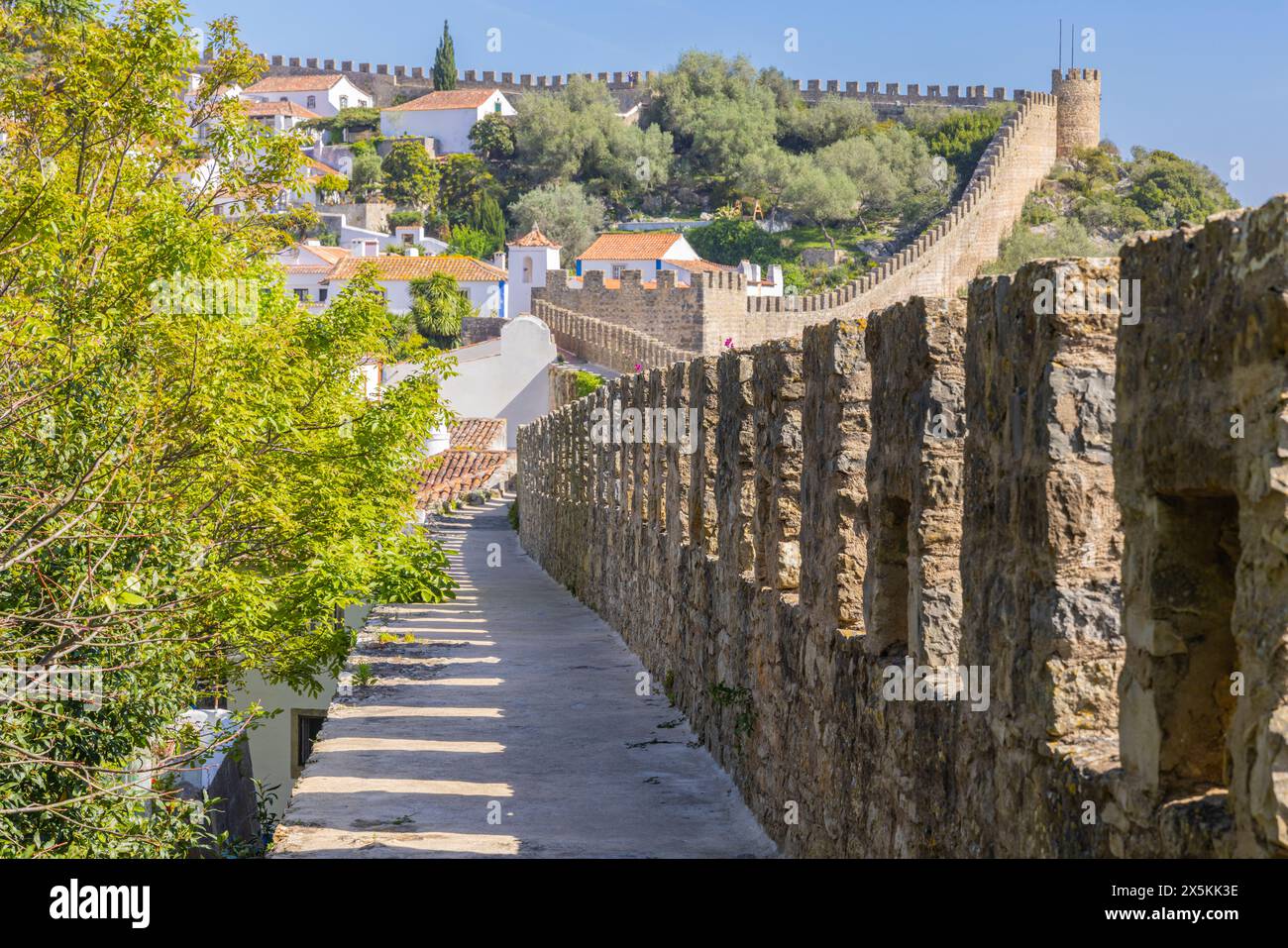 Portugal, Obidos. Castle wall and homes Stock Photo - Alamy