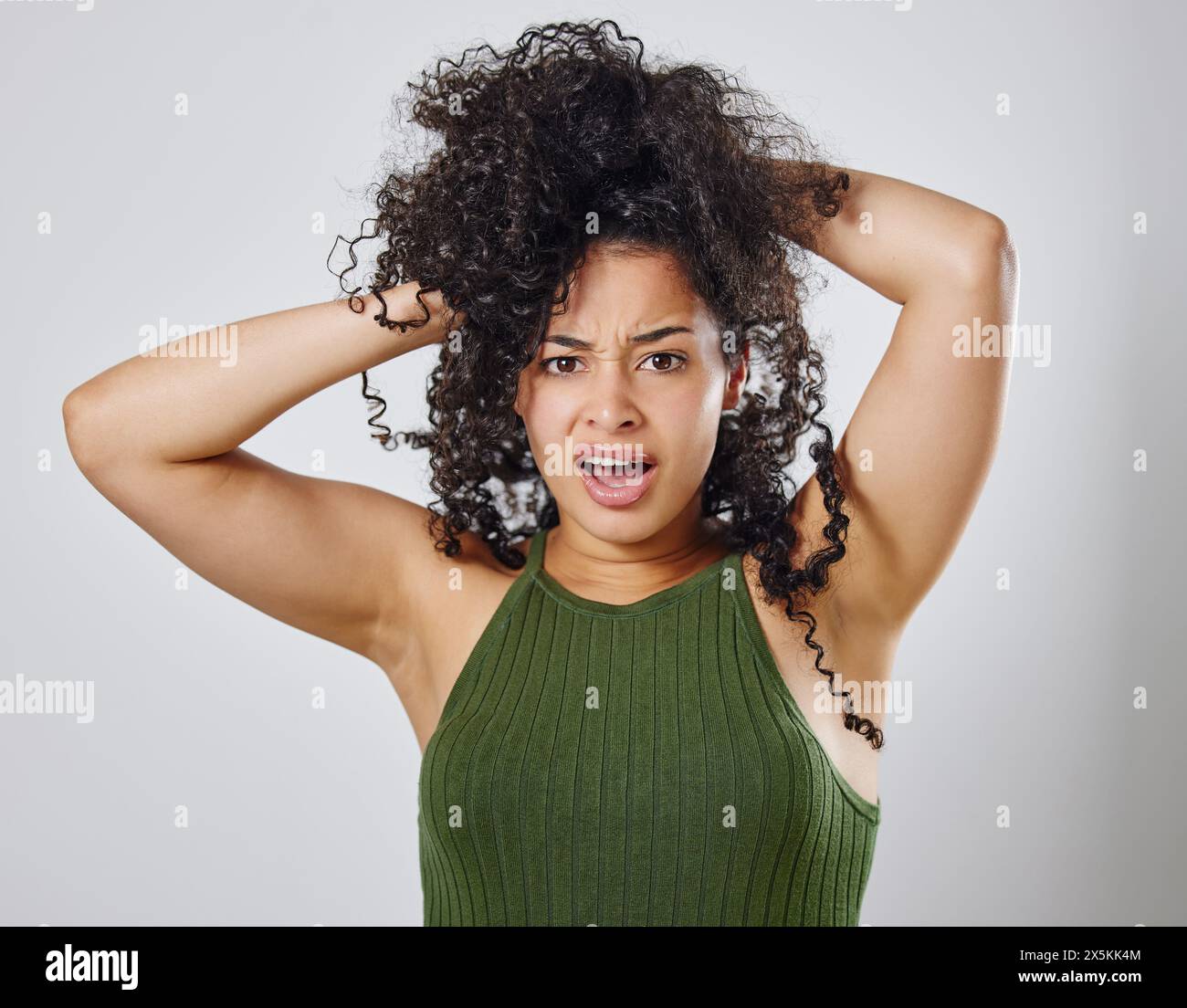 Portrait, messy and woman with stress, hair and shocked expression on ...