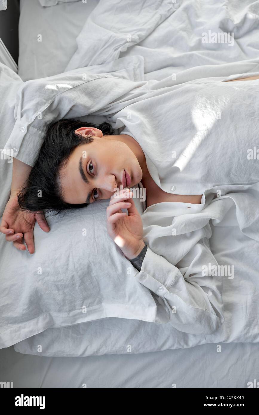 Attractive male model lying alone hi-res stock photography and images ...